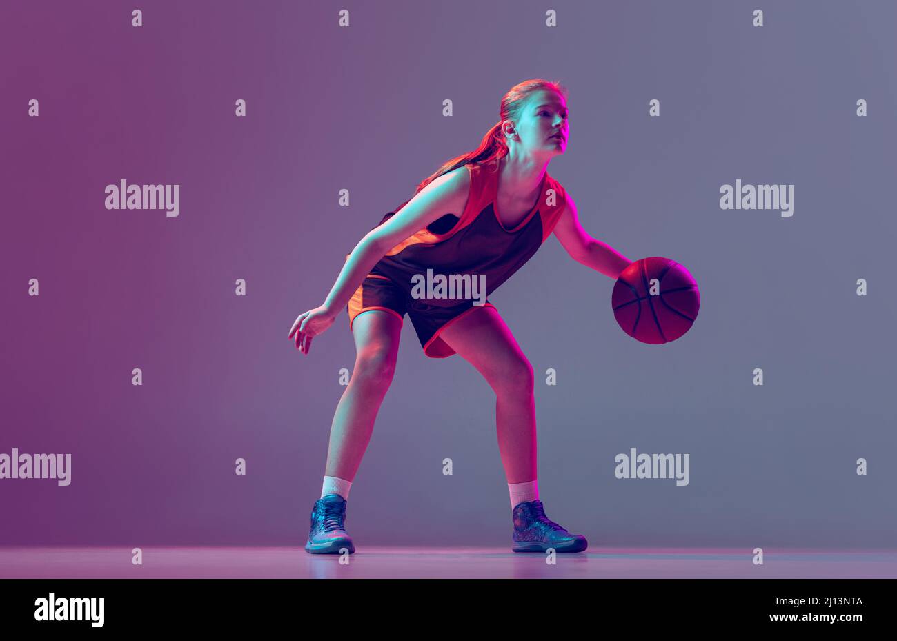 Portrait of young girl, teen, basketball player in motion, training ...