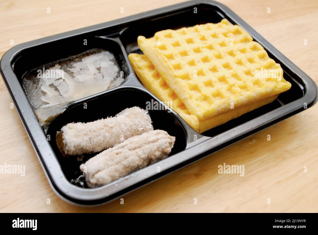 Two Square Waffles Served with Sausage Links Stock Photo - Alamy