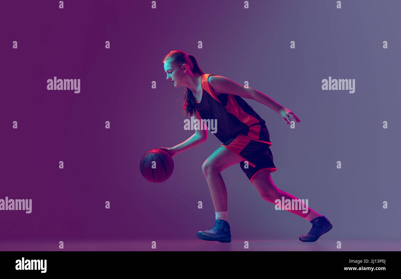 Portrait of young girl, teen, basketball player in motion, training ...