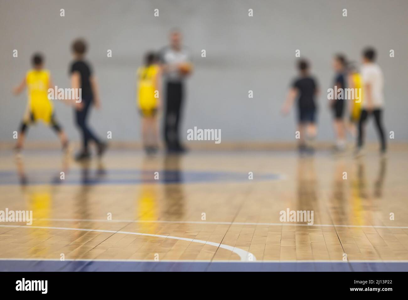View of basketball court hall indoor venue with junior teenage school ...