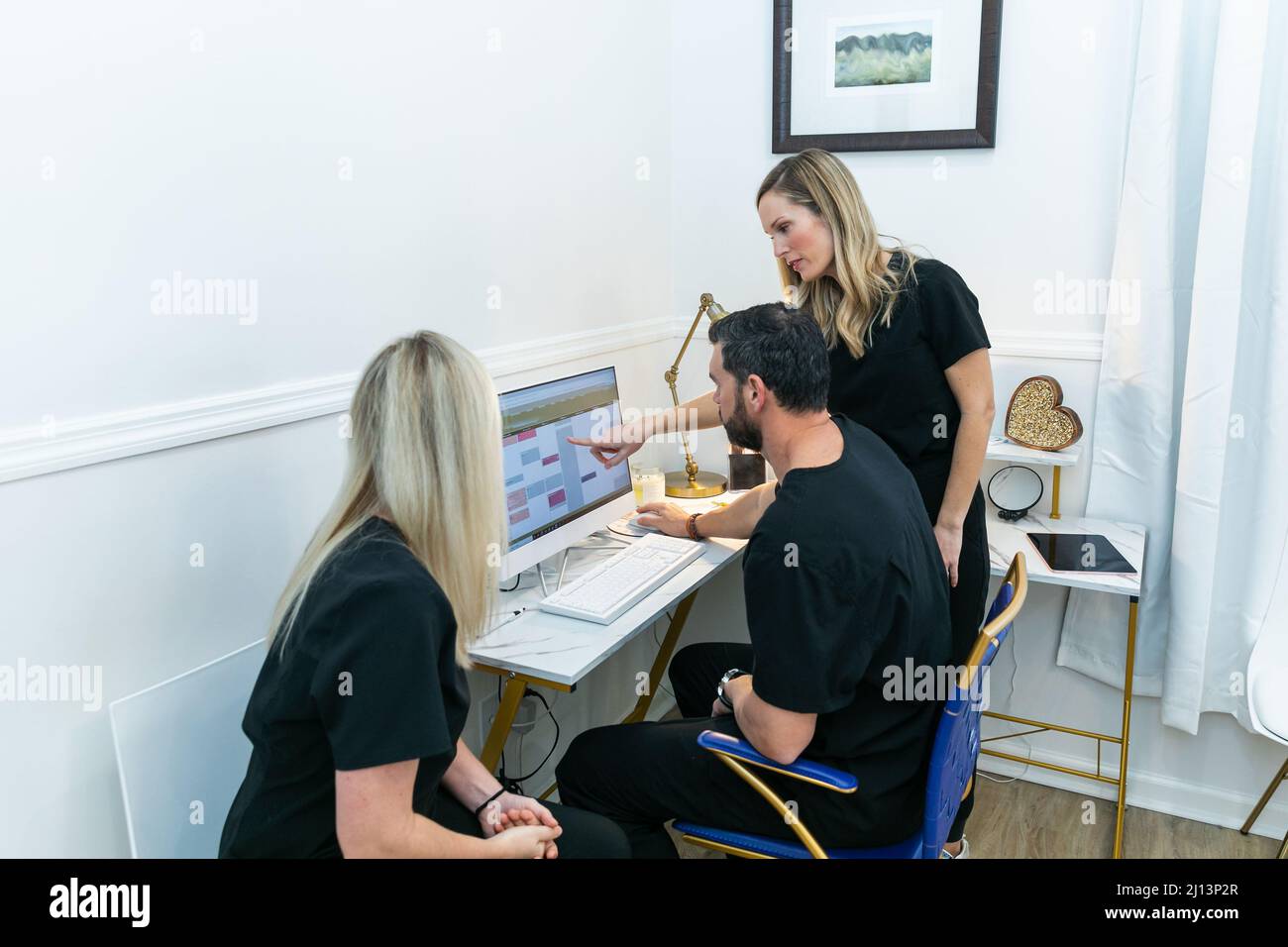 A male physician doctor at a medical spa and wellness clinic consulting ...