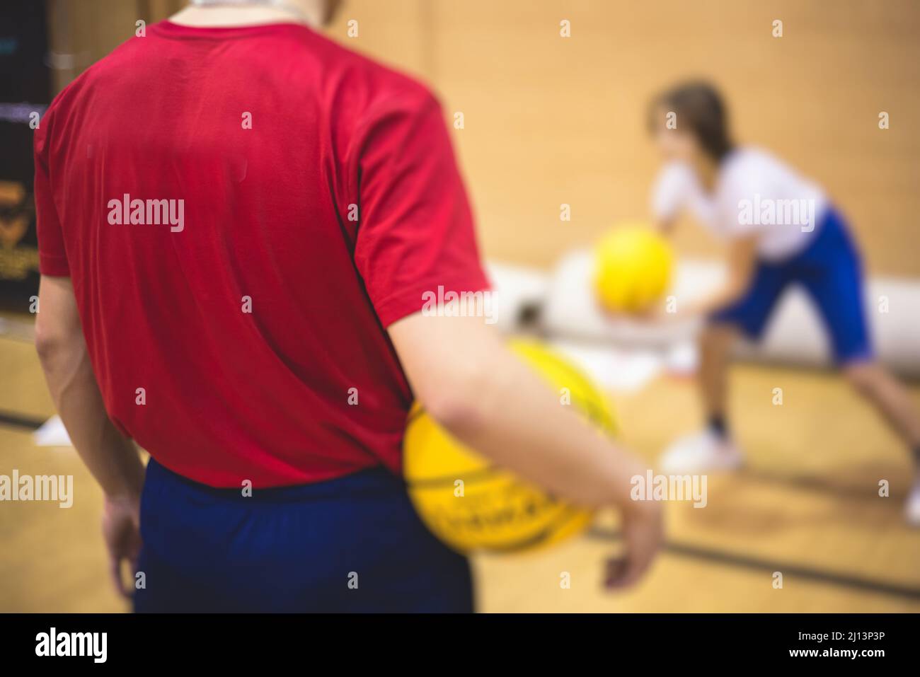 Junior young basketball team with a coach, group of kids children team ...