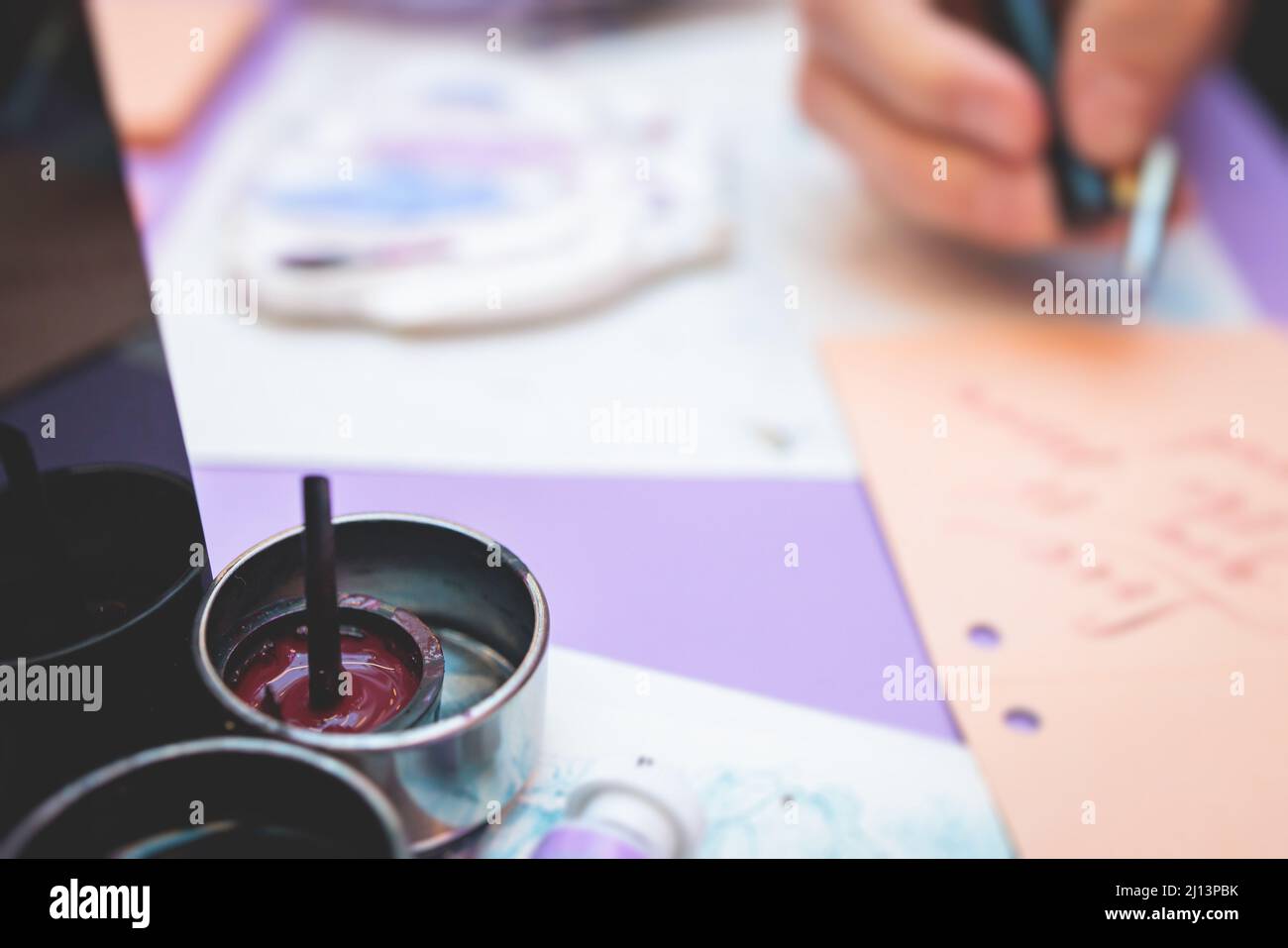 Process of calligraphy handwriting with an ink fountain pen feather ...