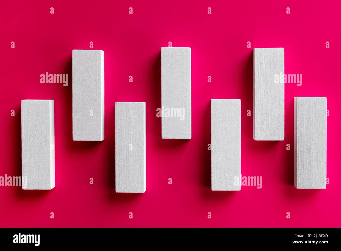 top view of white rectangular blocks on pink background Stock Photo - Alamy