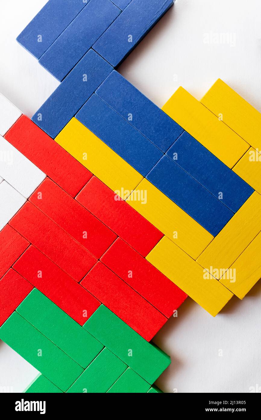 top view of red, yellow and blue rectangular blocks on white background ...