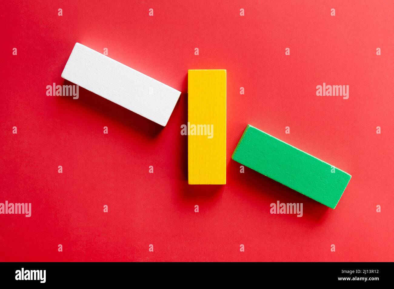 top view of green, white and yellow blocks on red background Stock ...
