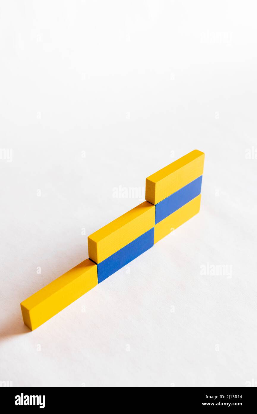 top view of stairs made of blue and yellow blocks on white background ...