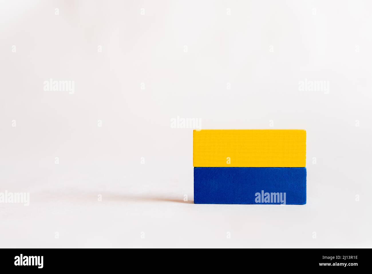 blue and yellow rectangular blocks on white background with copy space ...