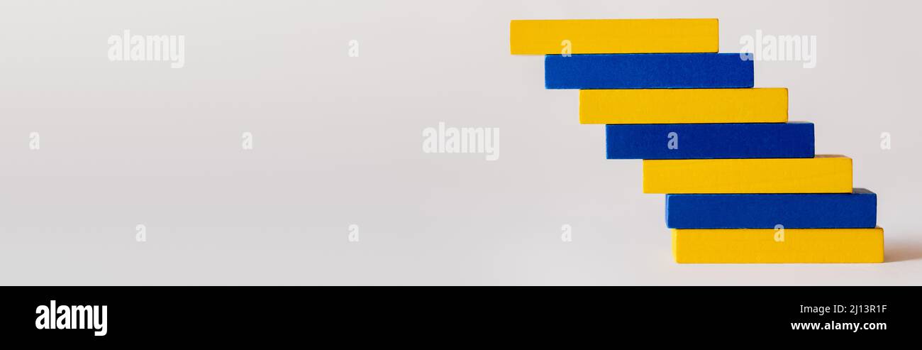 colored blue and yellow blocks stacked on white background, ukrainian ...