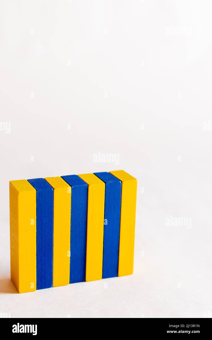 colored blue and yellow blocks on white background with copy space ...