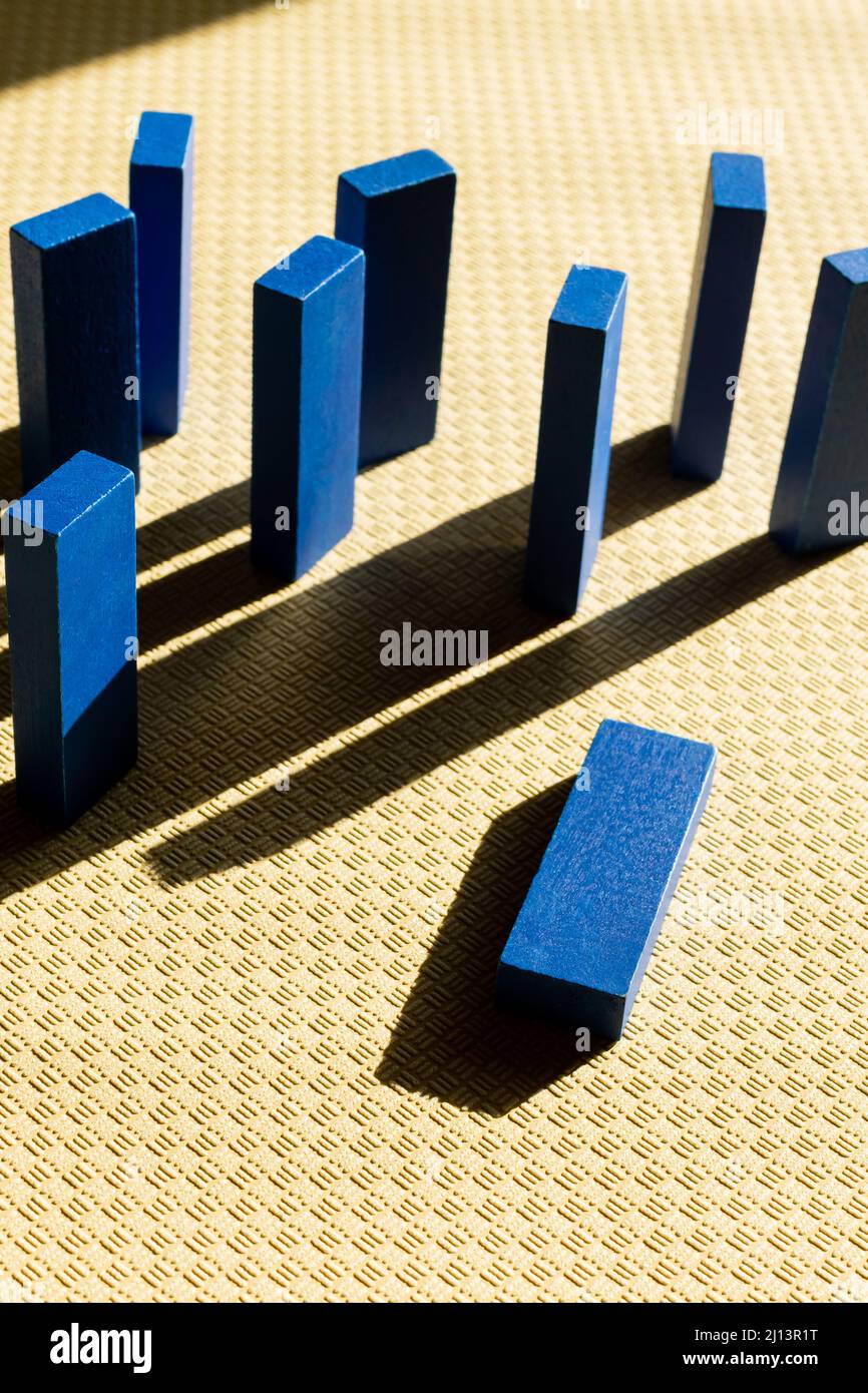 top view of blue rectangular blocks on beige background with shadows ...