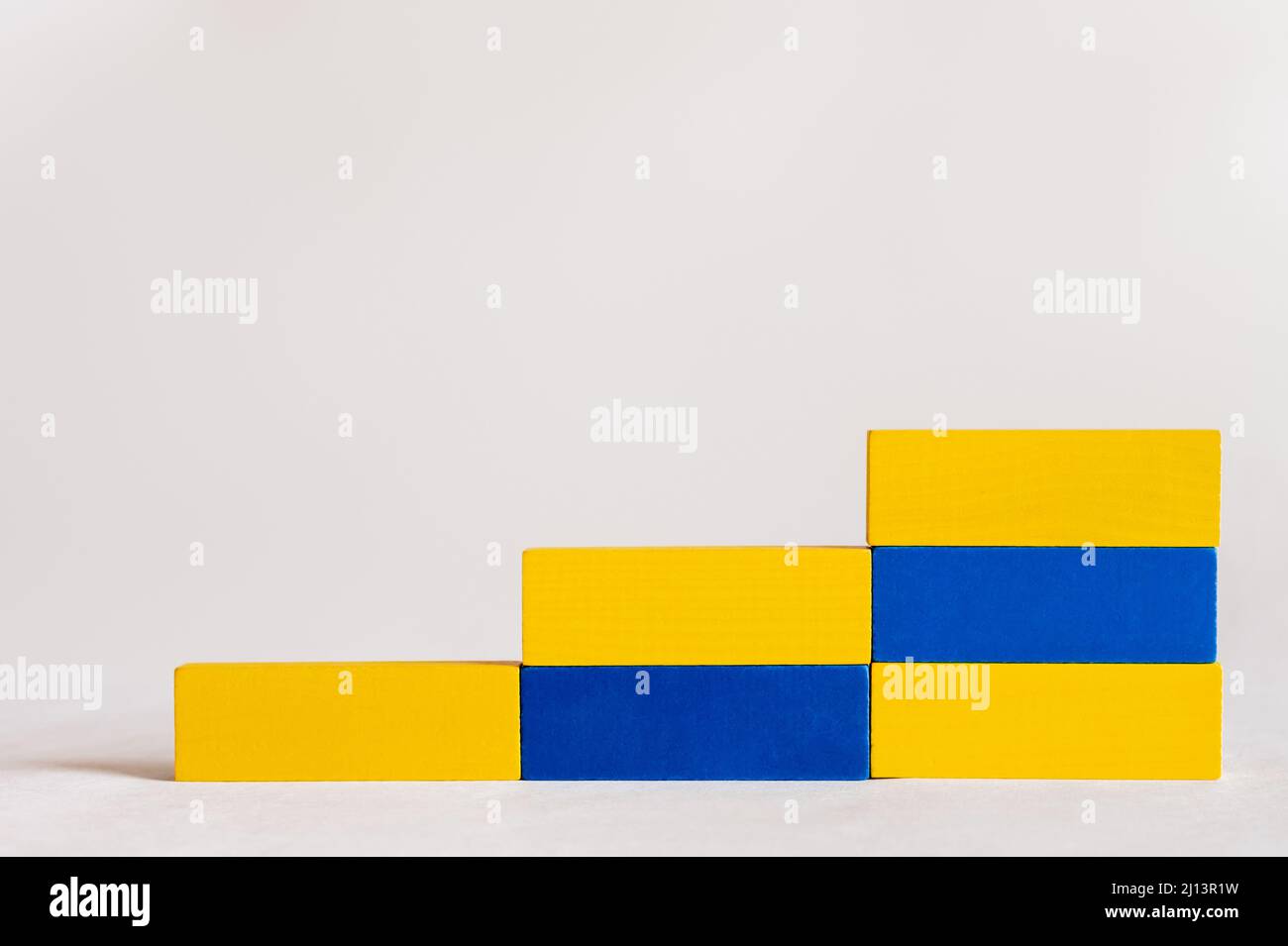 stairs made of rectangular blue and yellow blocks on white background ...