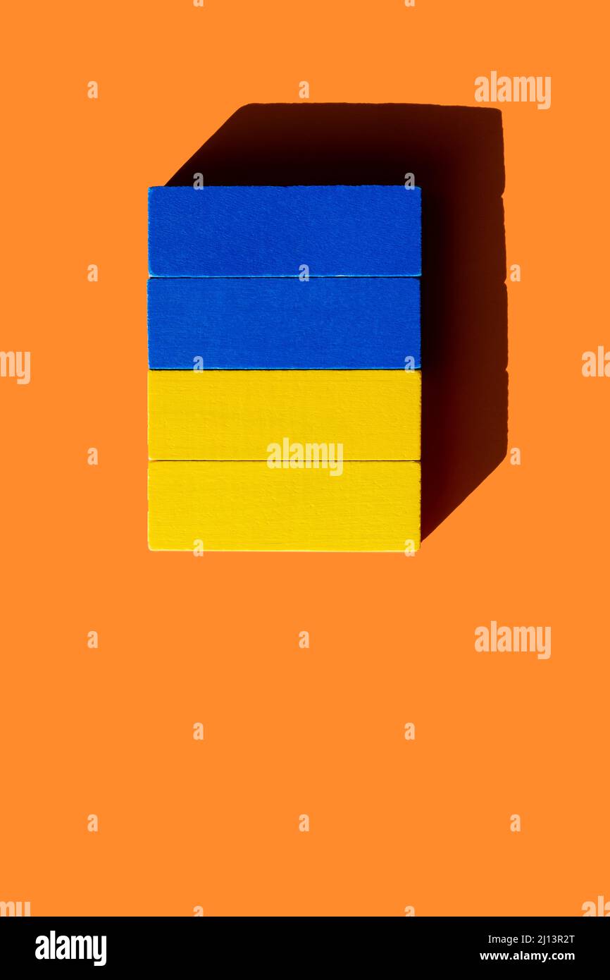 bright blue and yellow blocks on orange background, top view, ukrainian ...