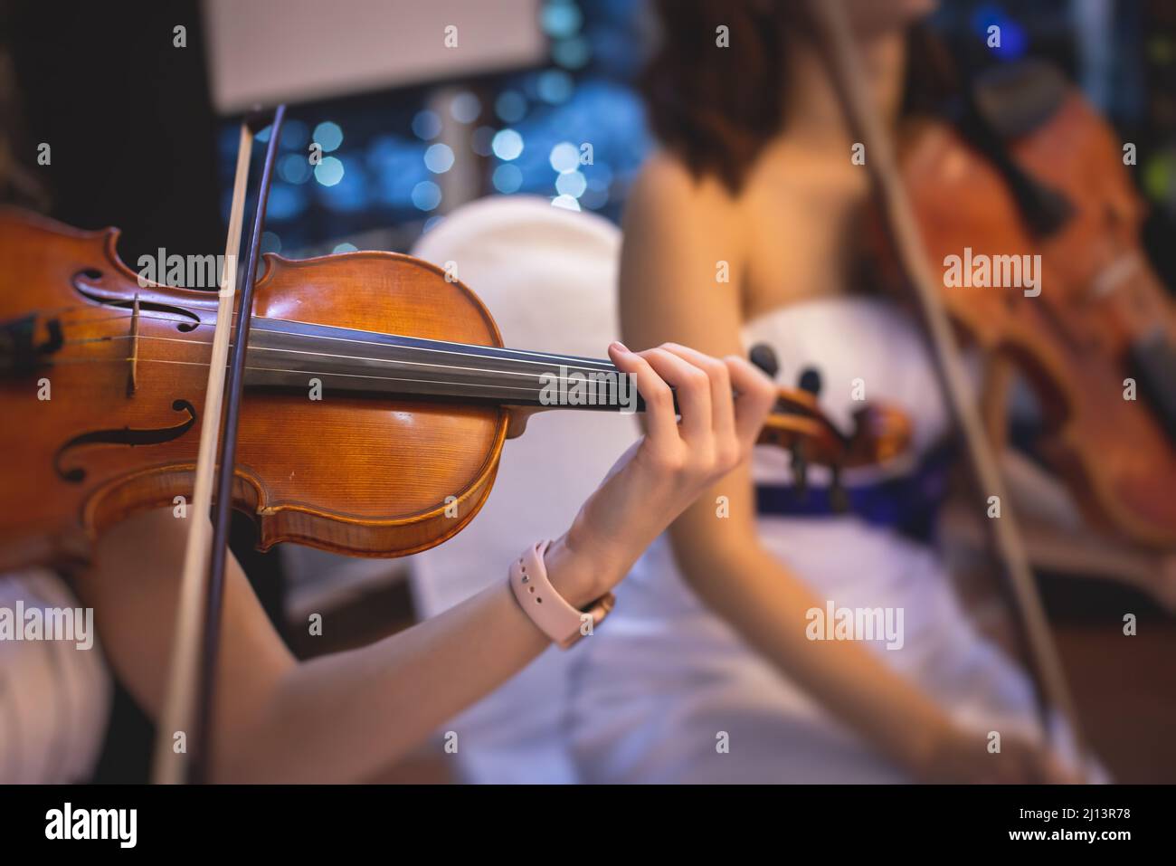 Female violin player, fiddler violinist with a bow performing music on ...