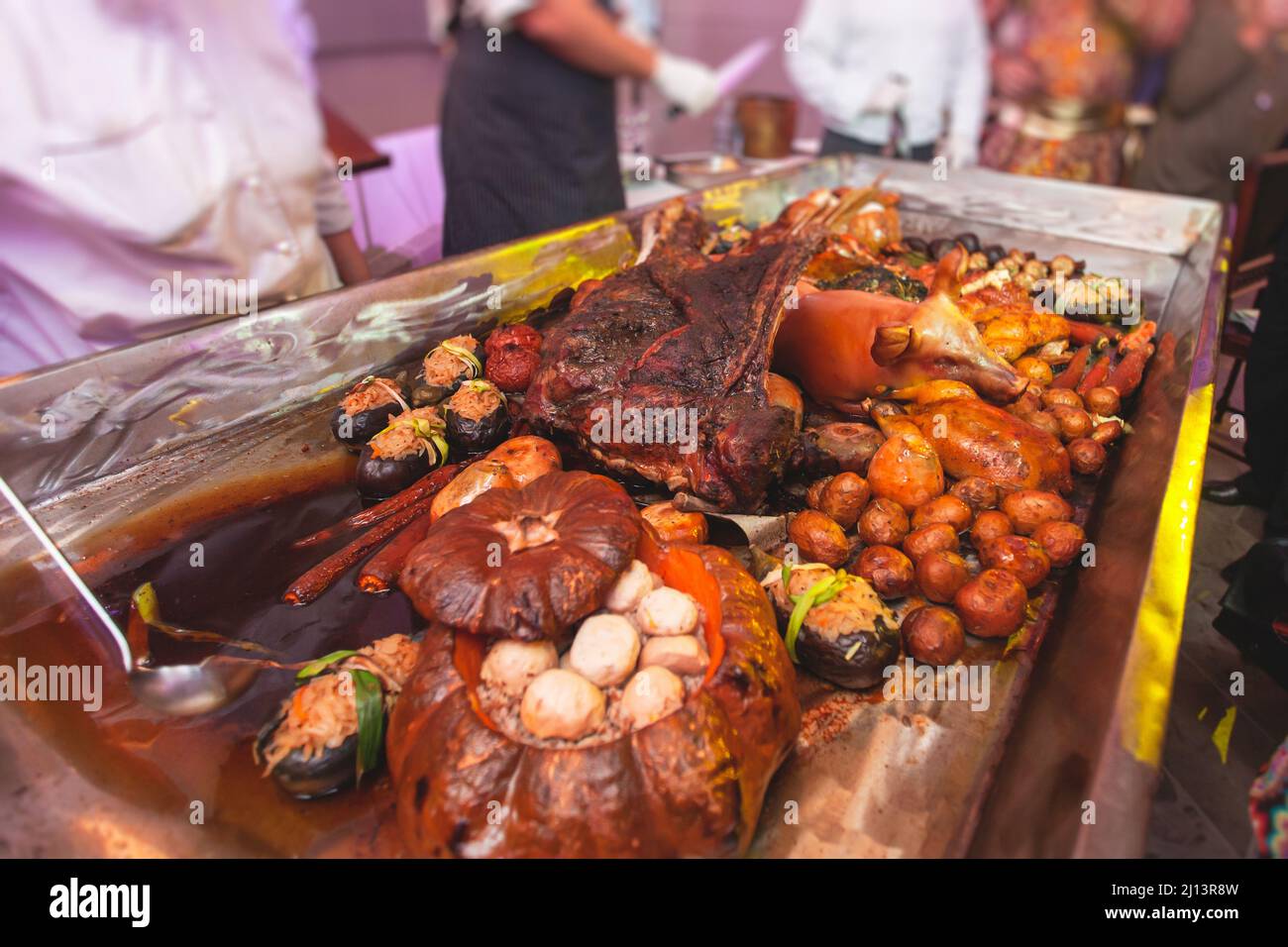 Big giant dish plate with a roasted full pig pork head, served in ...