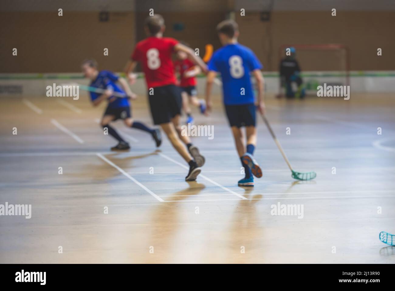 View of floorball match game, court hall indoor venue with junior ...