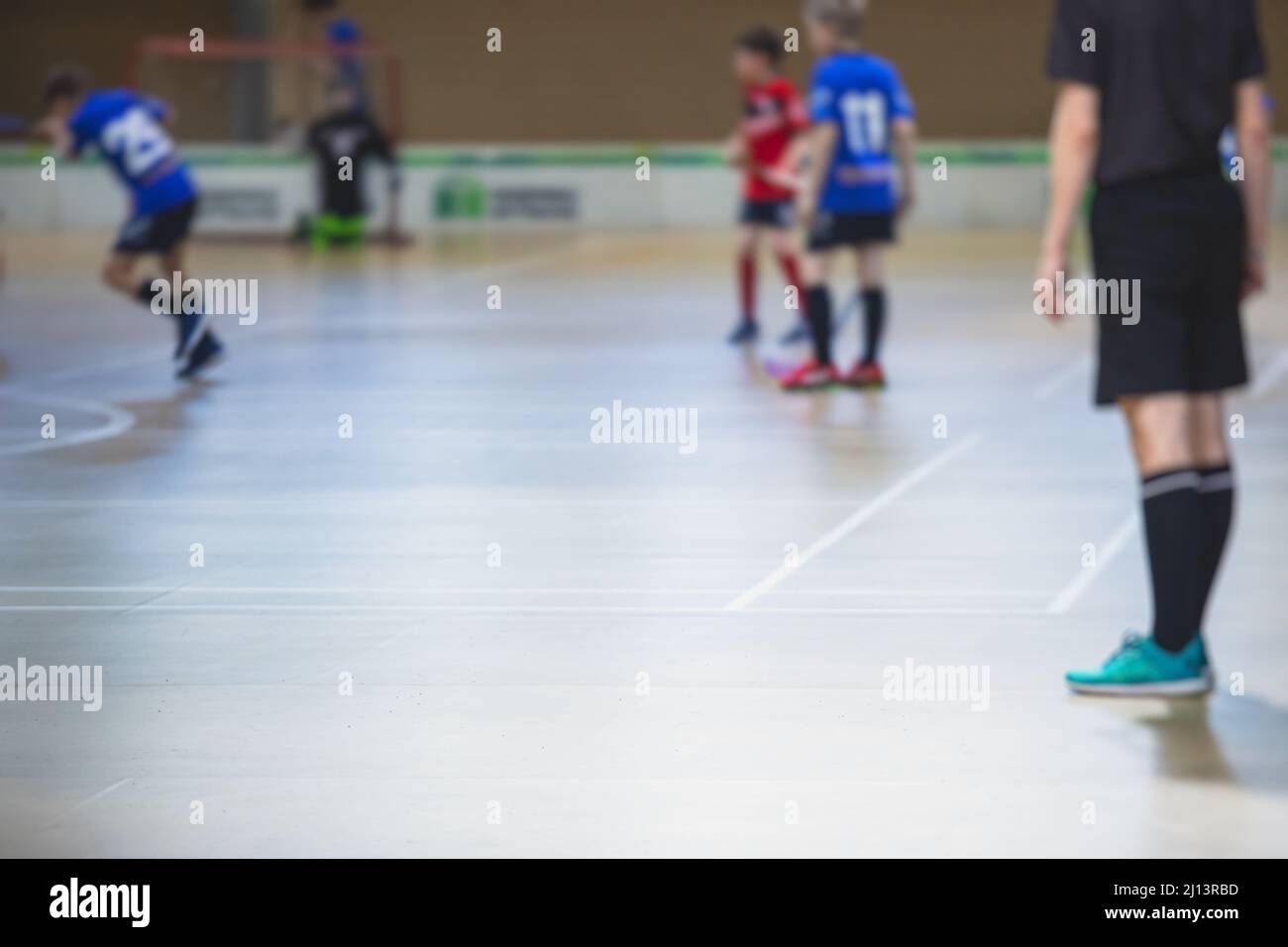 View of floorball match game, court hall indoor venue with junior ...
