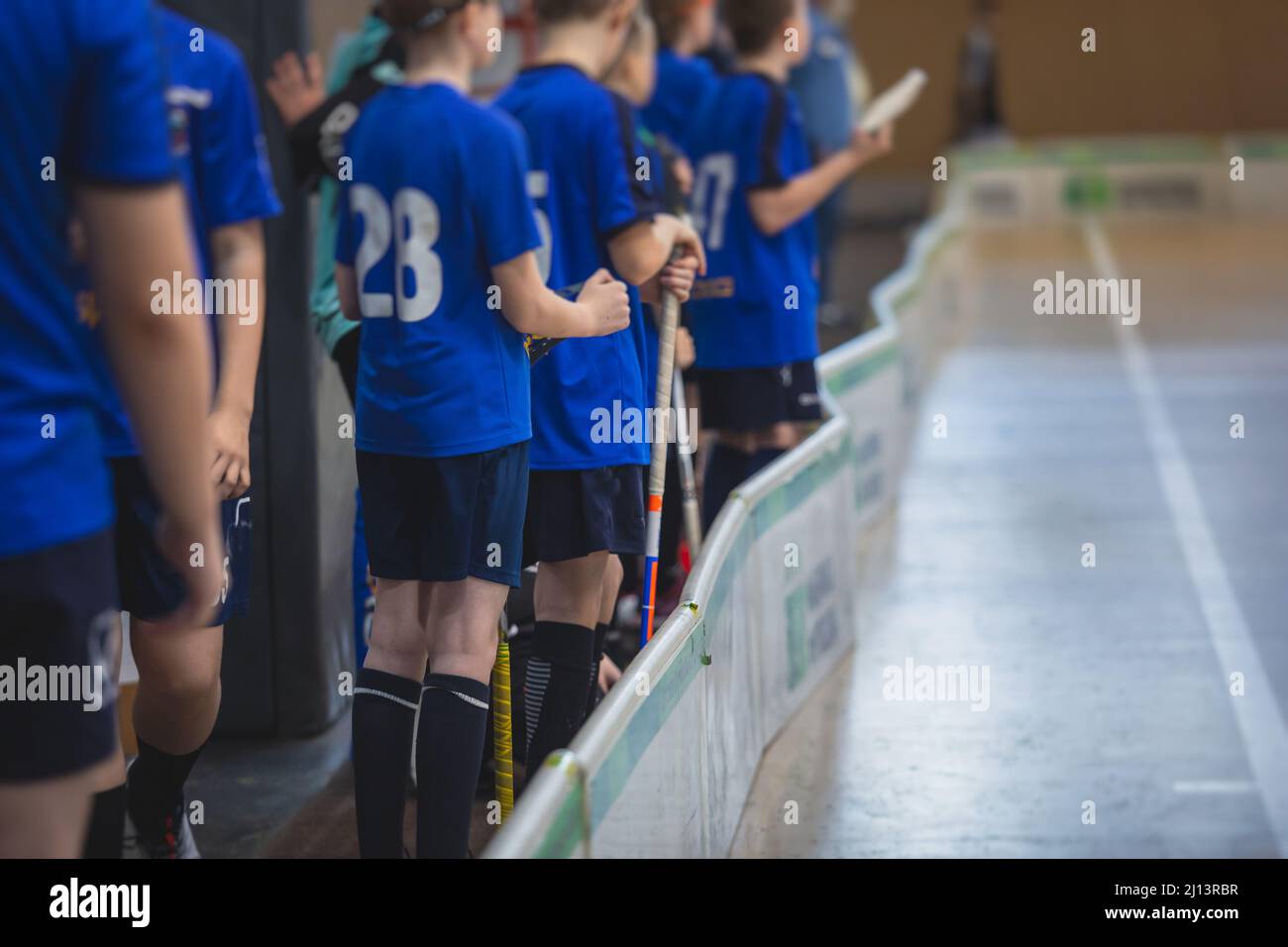 View of floorball match game, court hall indoor venue with junior ...