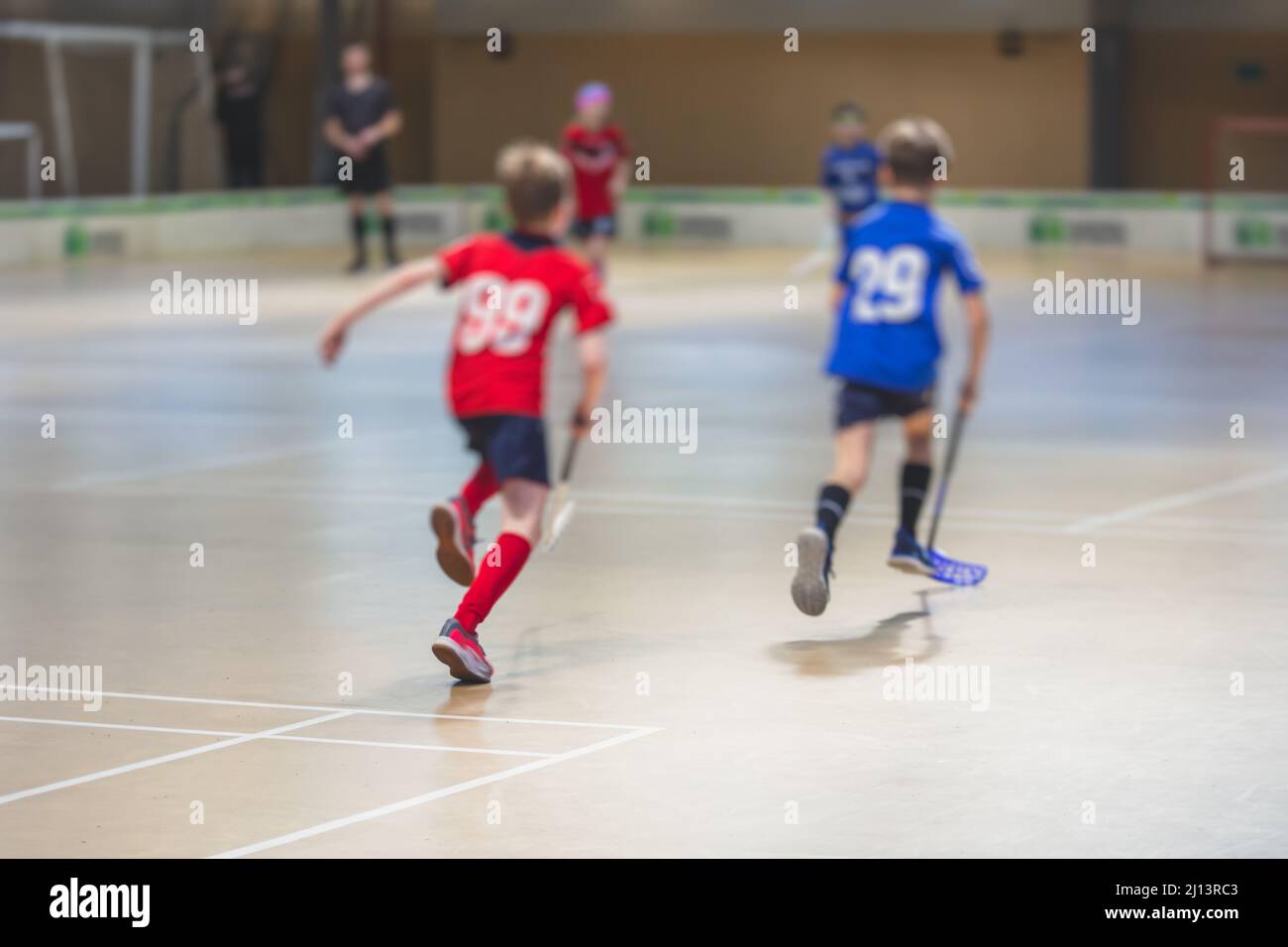 View of floorball match game, court hall indoor venue with junior ...