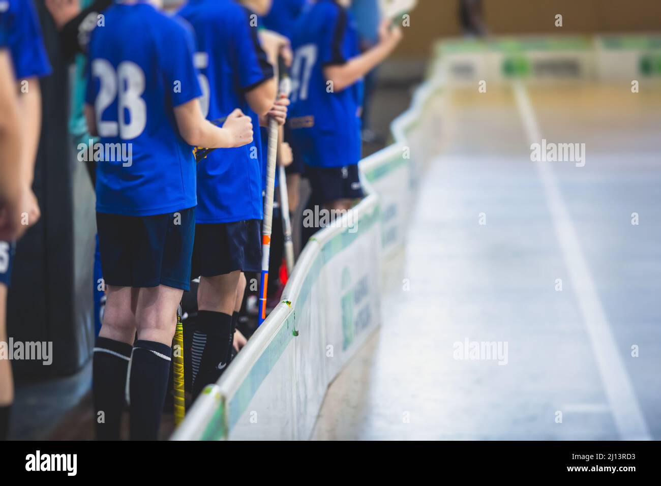 View of floorball match game, court hall indoor venue with junior ...