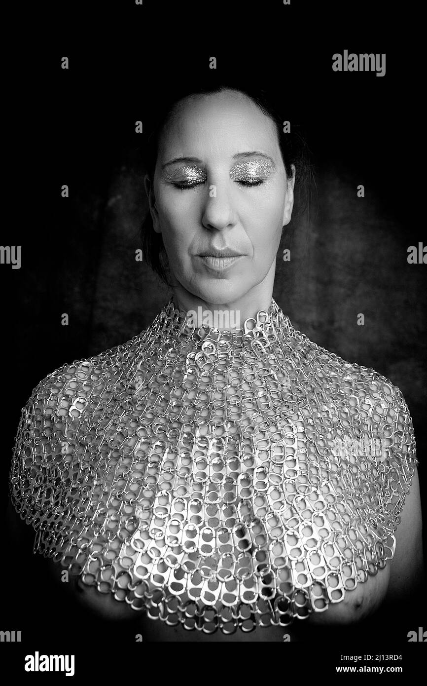 woman with metallic armor made with recycled cans IV Stock Photo - Alamy