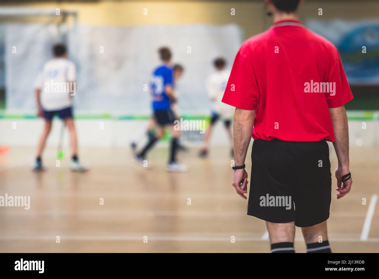 View of floorball match game, court hall indoor venue with junior ...