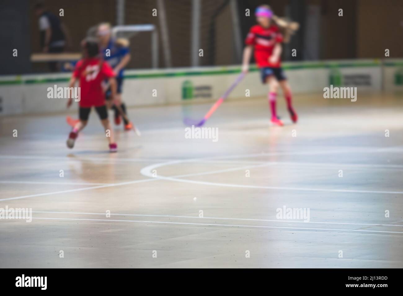 View of floorball match game, court hall indoor venue with junior ...