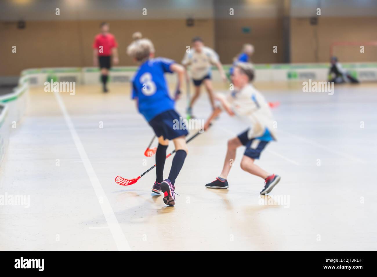 View of floorball match game, court hall indoor venue with junior ...