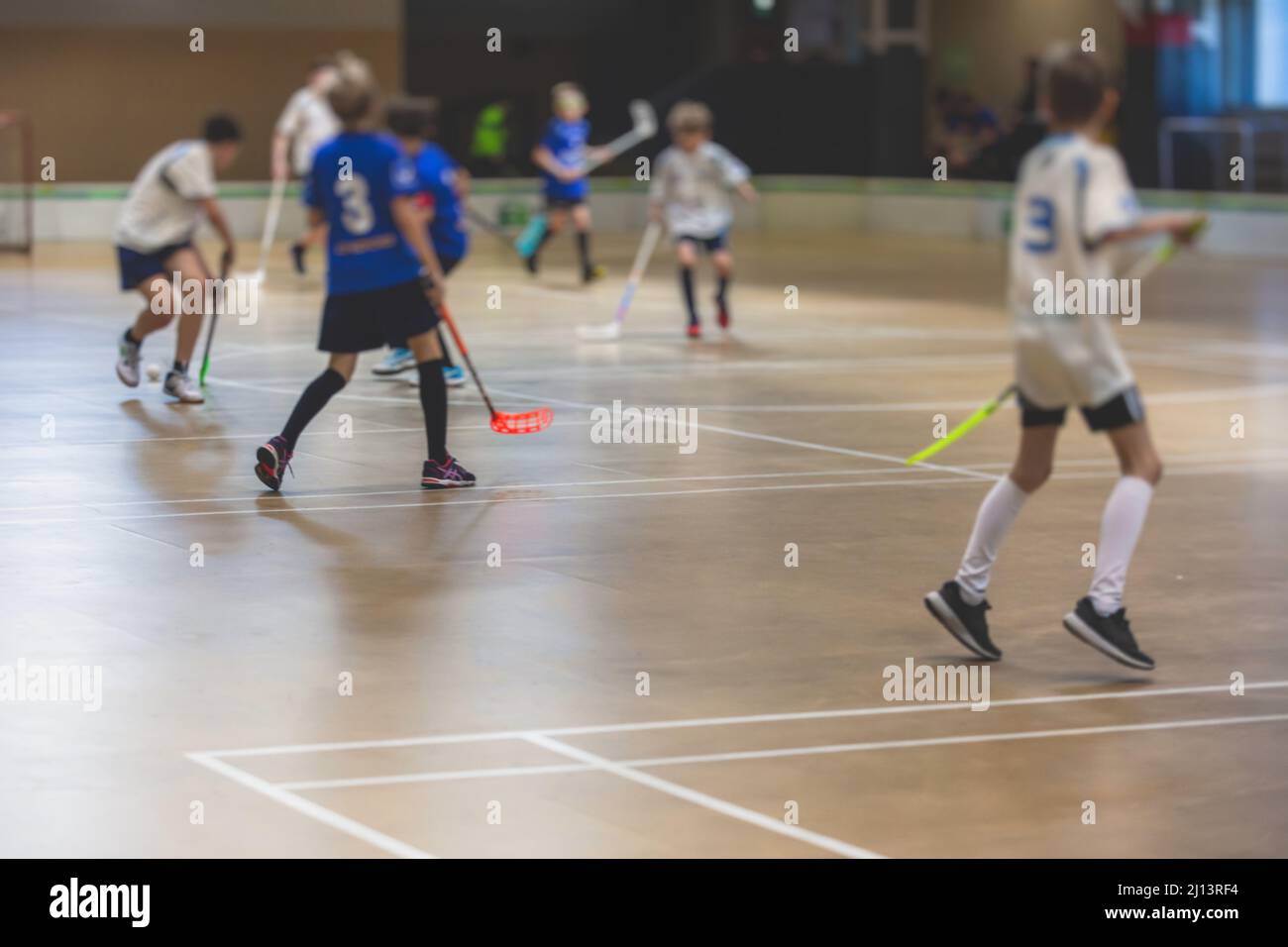 View of floorball match game, court hall indoor venue with junior ...