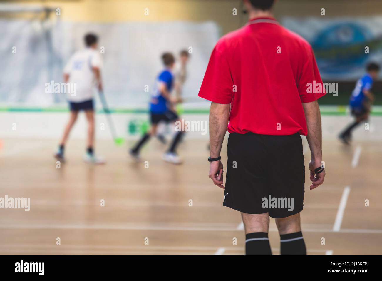 View of floorball match game, court hall indoor venue with junior ...