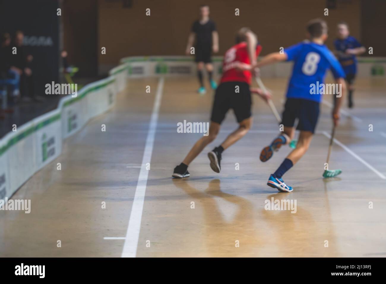 View of floorball match game, court hall indoor venue with junior ...