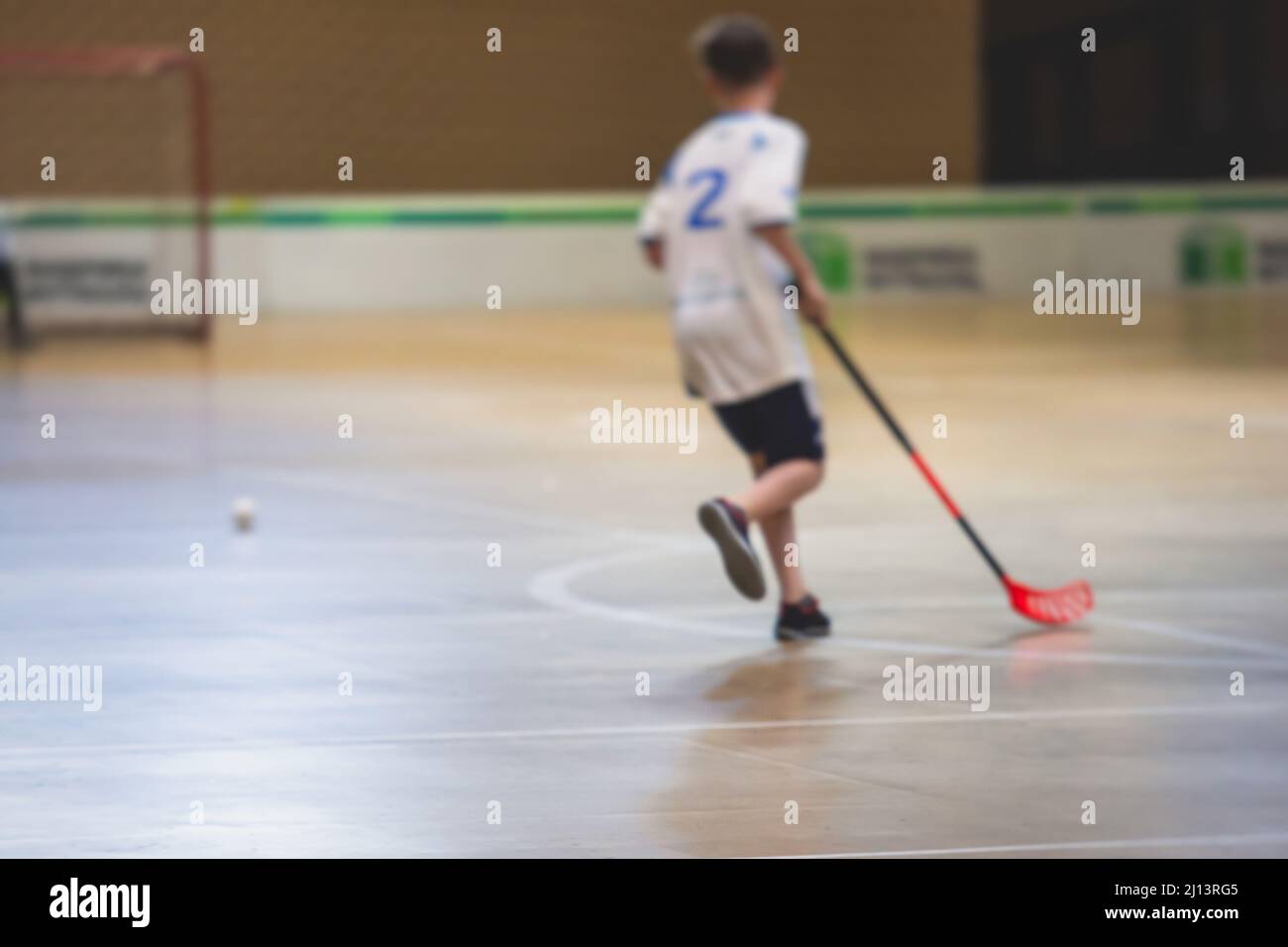 View of floorball match game, court hall indoor venue with junior ...