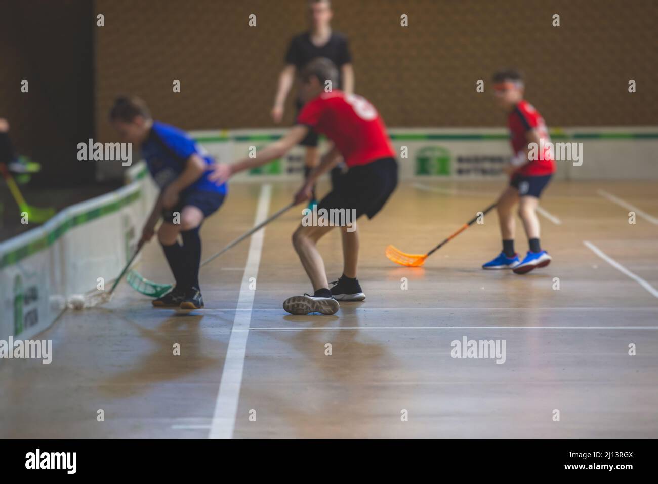 View of floorball match game, court hall indoor venue with junior ...
