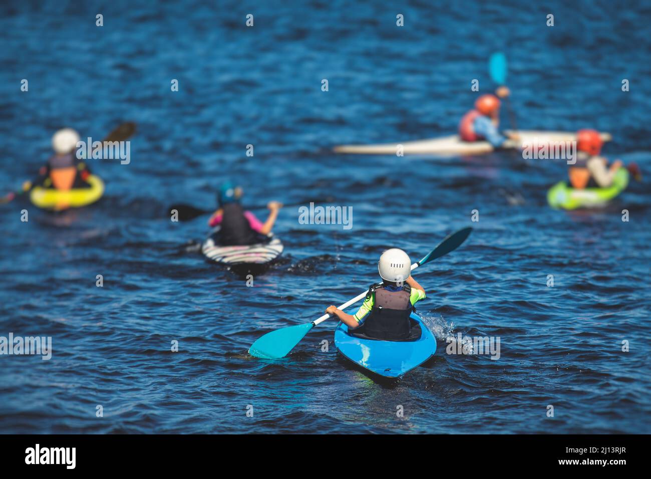 Kids learn kayaking, canoeing whitewater training in the lake river ...