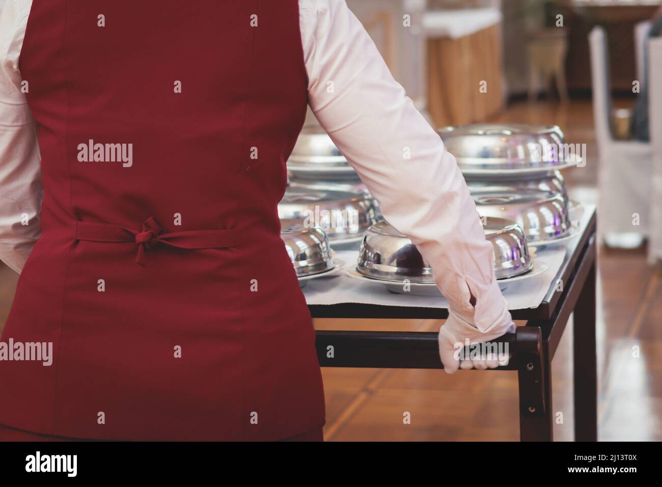 Process of serving luxury dinner in a cloche plate dish with a lid ...