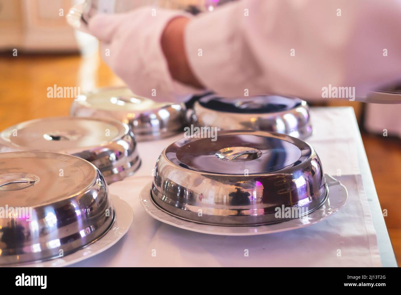 Process of serving luxury dinner in a cloche plate dish with a lid ...
