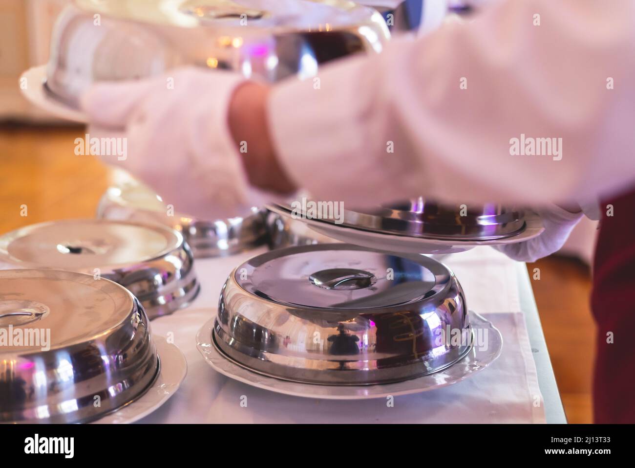 Process of serving luxury dinner in a cloche plate dish with a lid ...