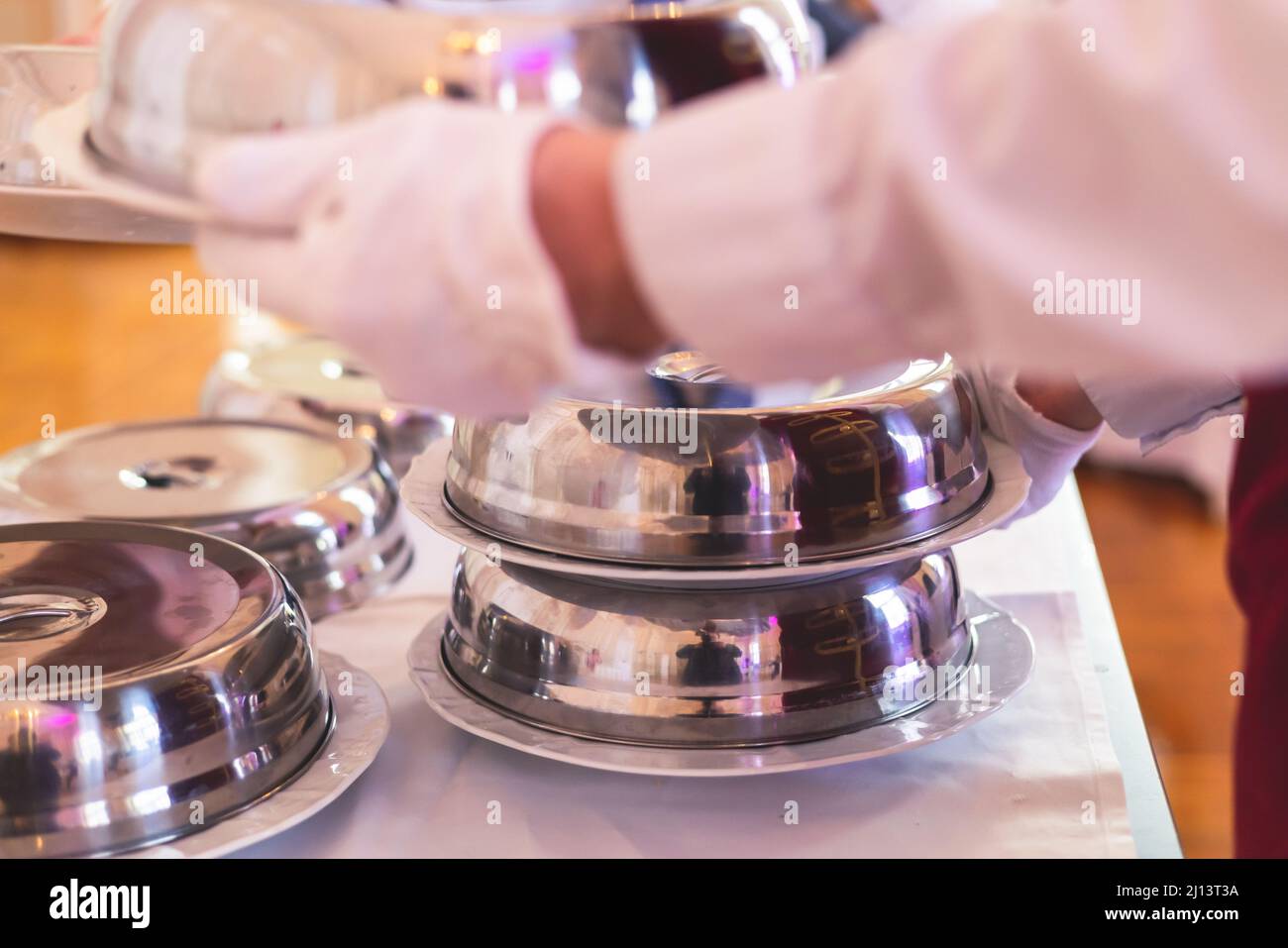 Process of serving luxury dinner in a cloche plate dish with a lid ...