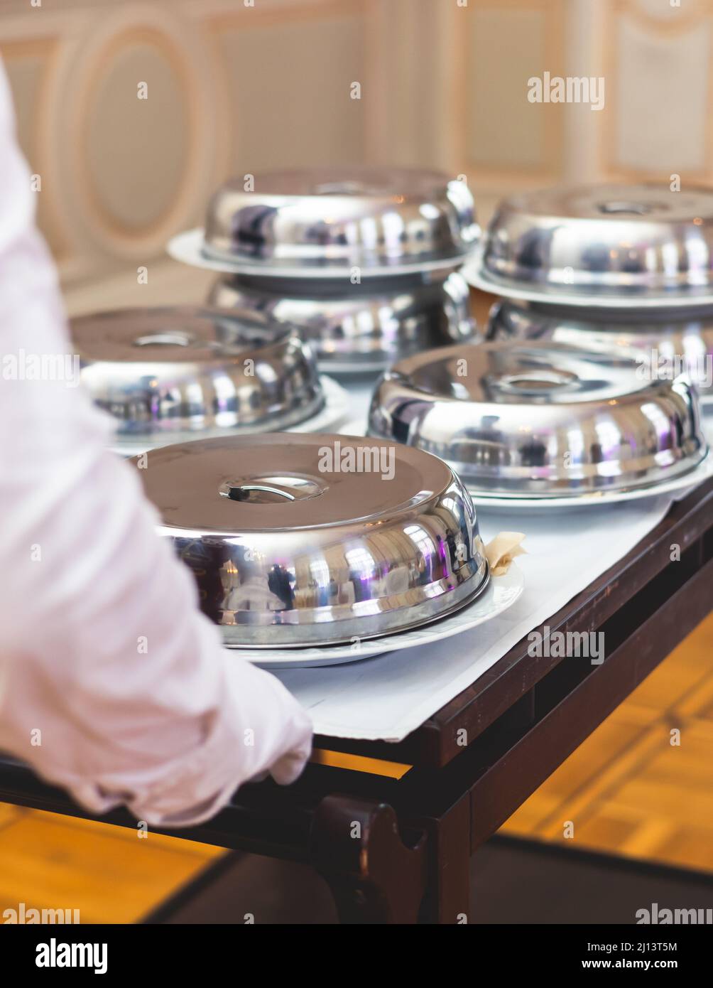 Process of serving luxury dinner in a cloche plate dish with a lid ...