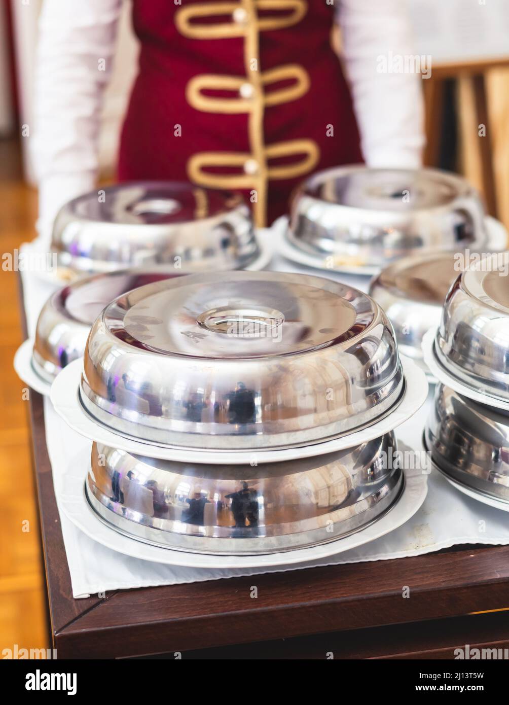 Process of serving luxury dinner in a cloche plate dish with a lid ...