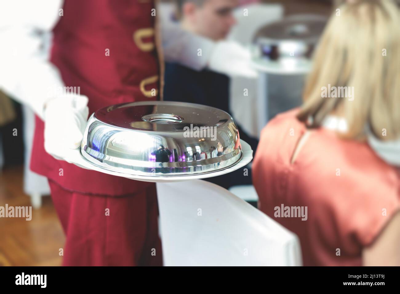 Process of serving luxury dinner in a cloche plate dish with a lid ...