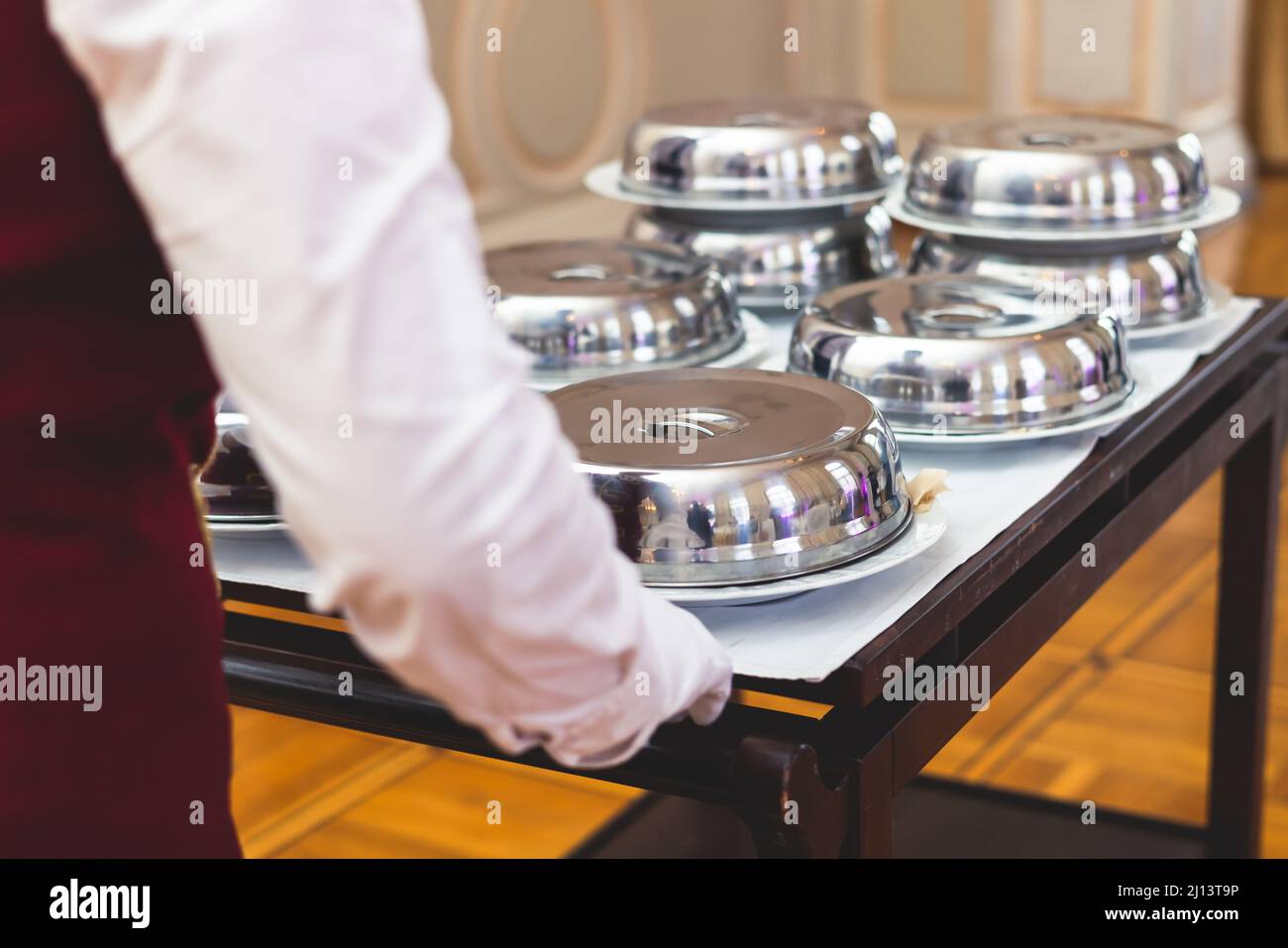Process of serving luxury dinner in a cloche plate dish with a lid ...