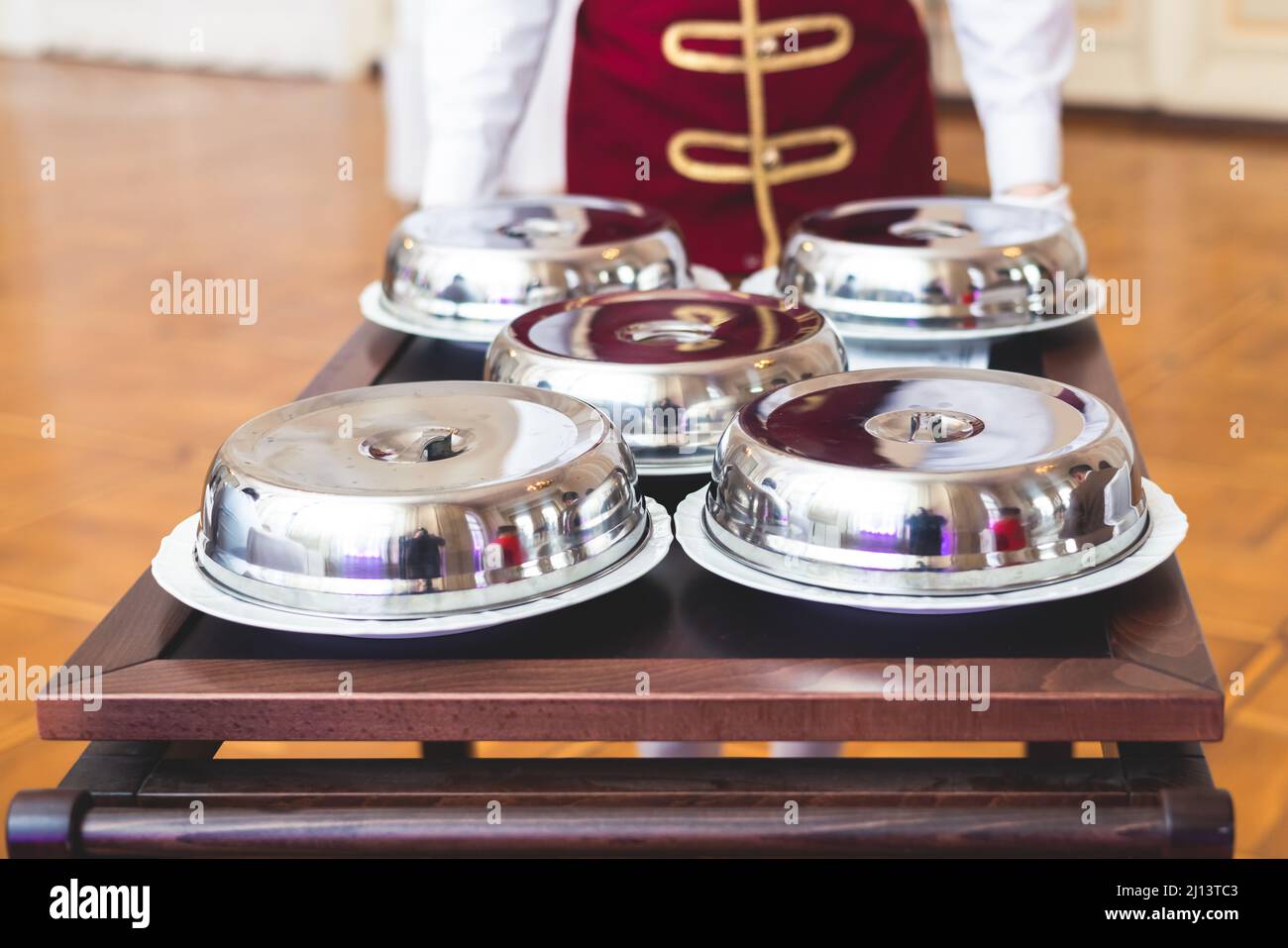 Process of serving luxury dinner in a cloche plate dish with a lid ...