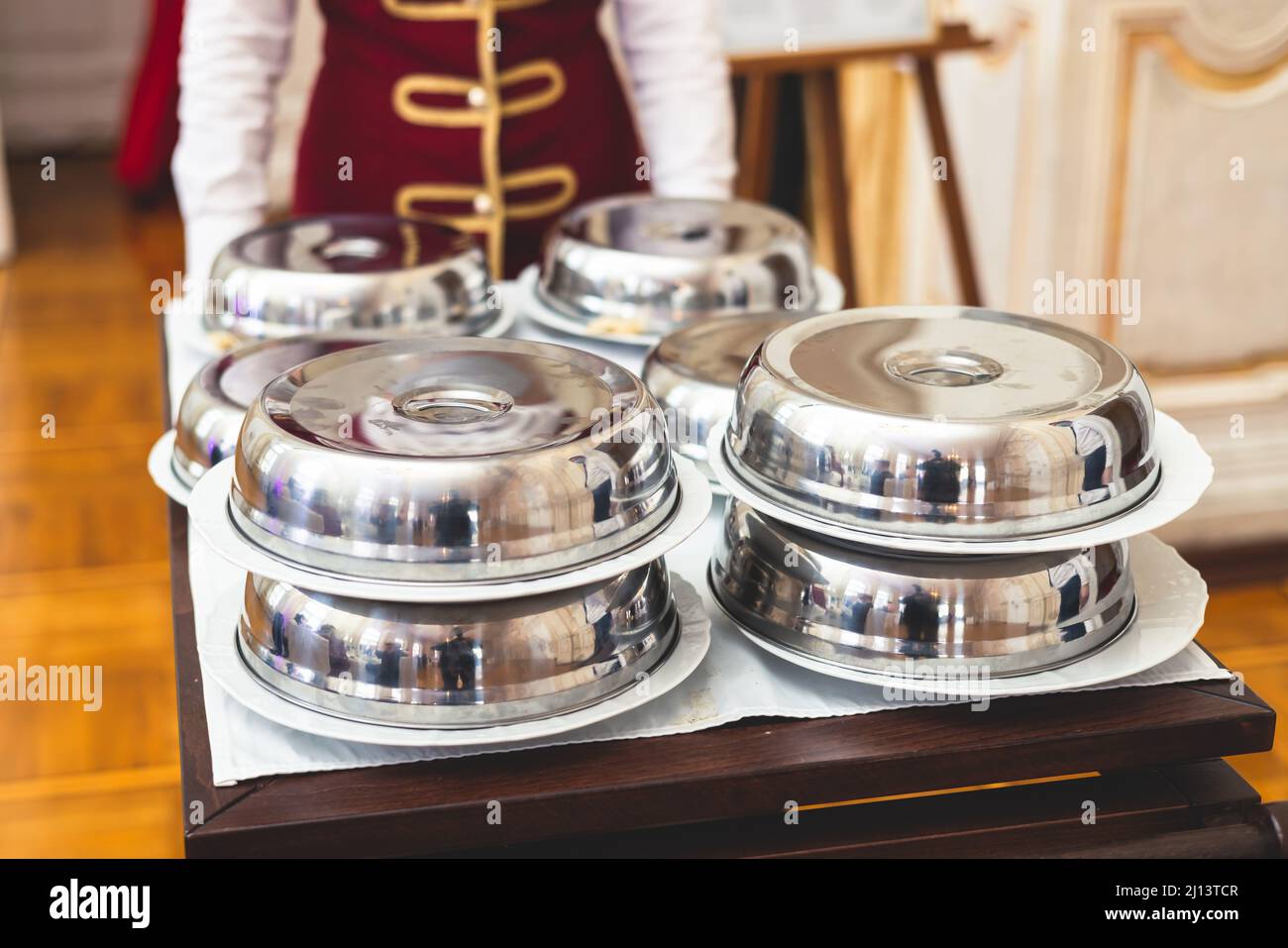 Process of serving luxury dinner in a cloche plate dish with a lid ...