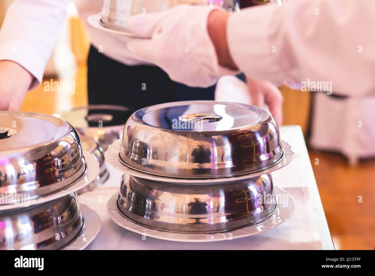 Process of serving luxury dinner in a cloche plate dish with a lid ...