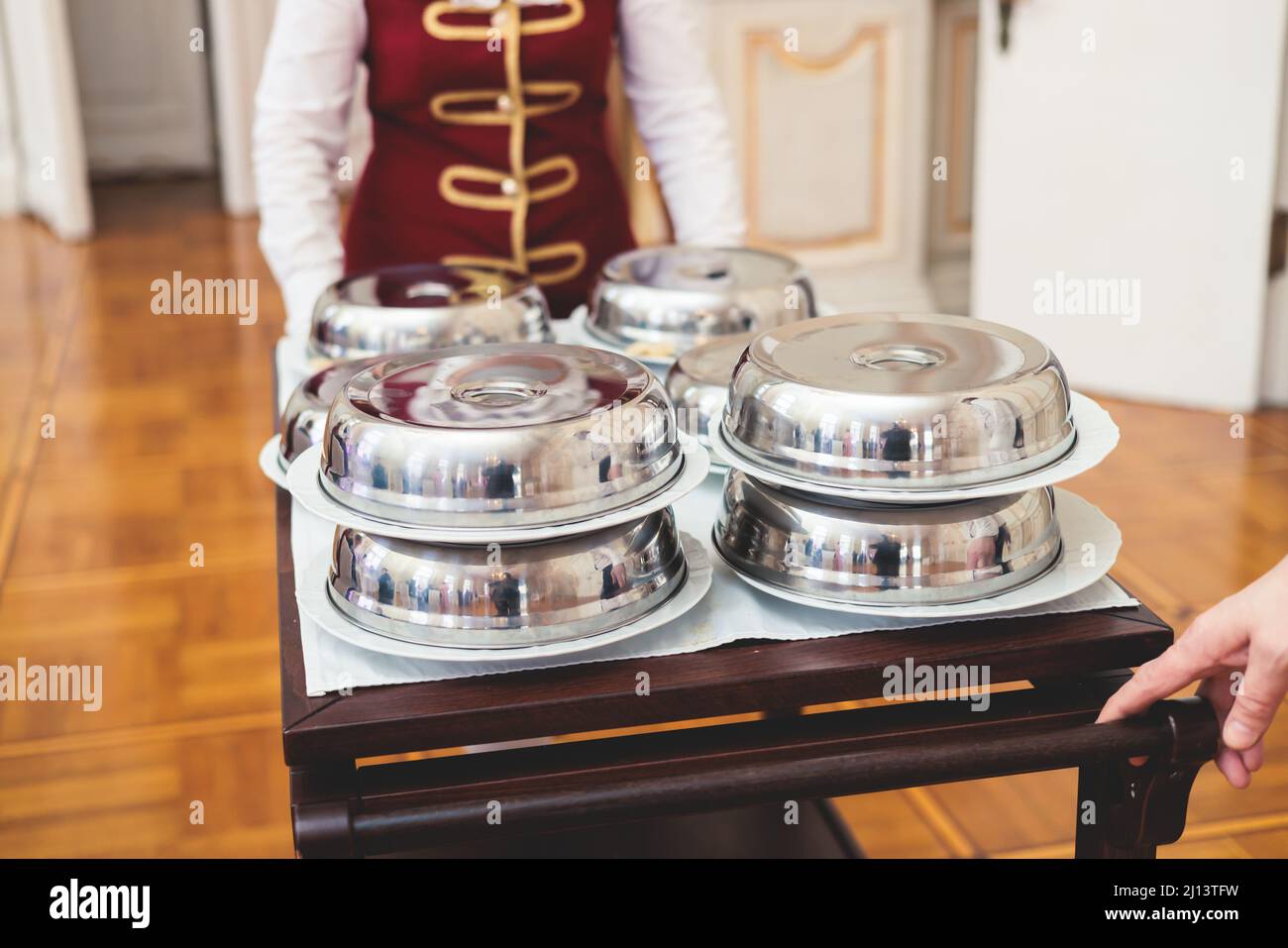 Process of serving luxury dinner in a cloche plate dish with a lid ...
