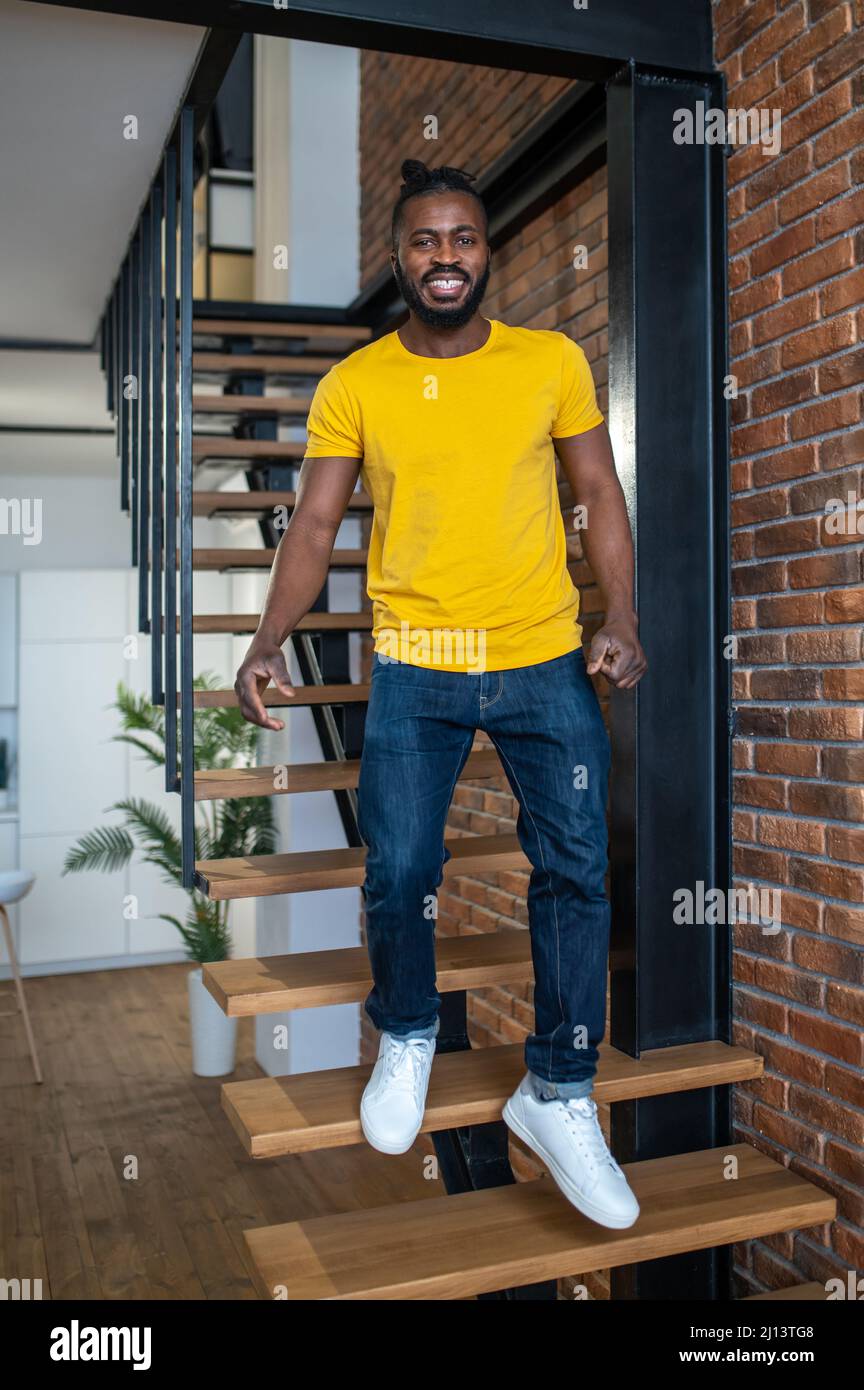 Man descending stairs hi-res stock photography and images - Alamy