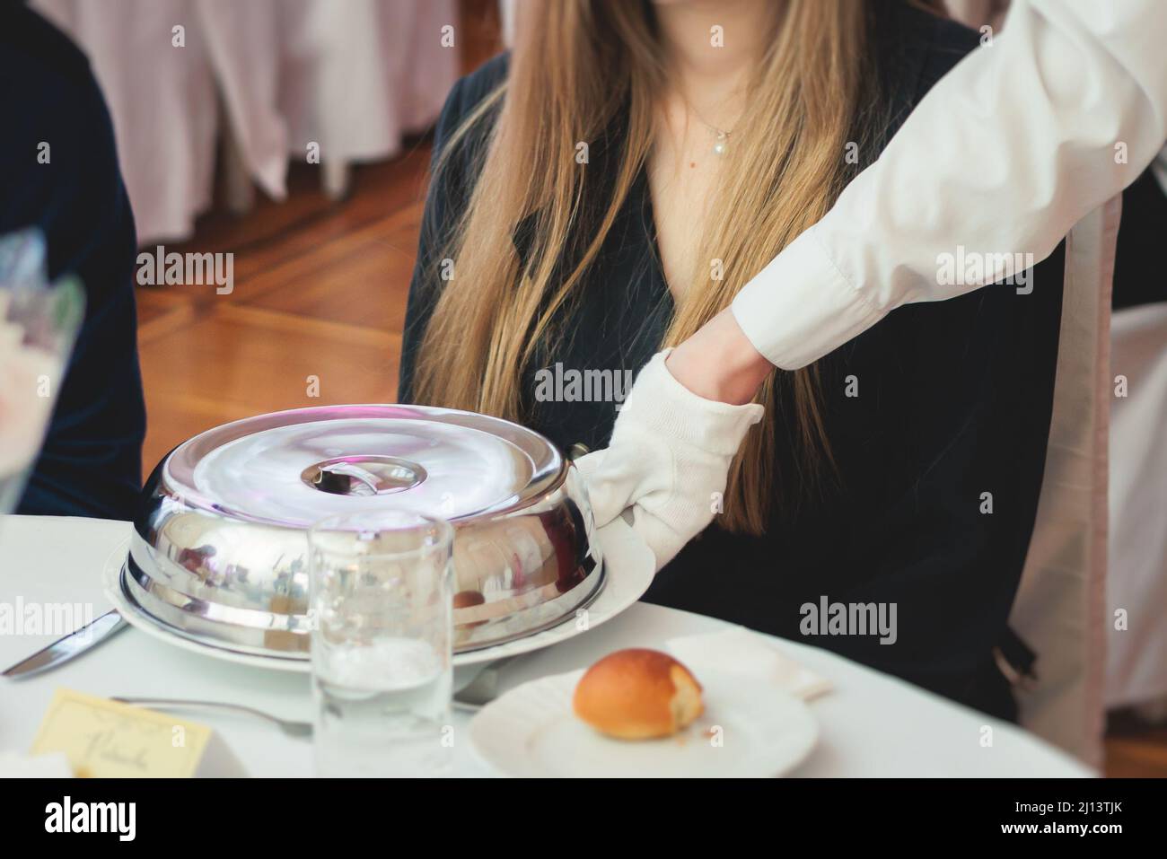 Process of serving luxury dinner in a cloche plate dish with a lid ...