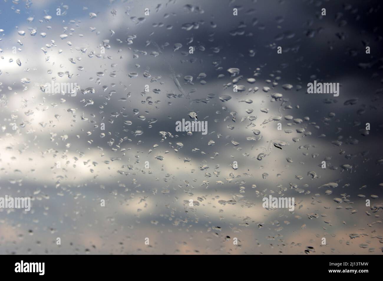 Raindrops on the glass and storm clouds in the sky Stock Photo - Alamy