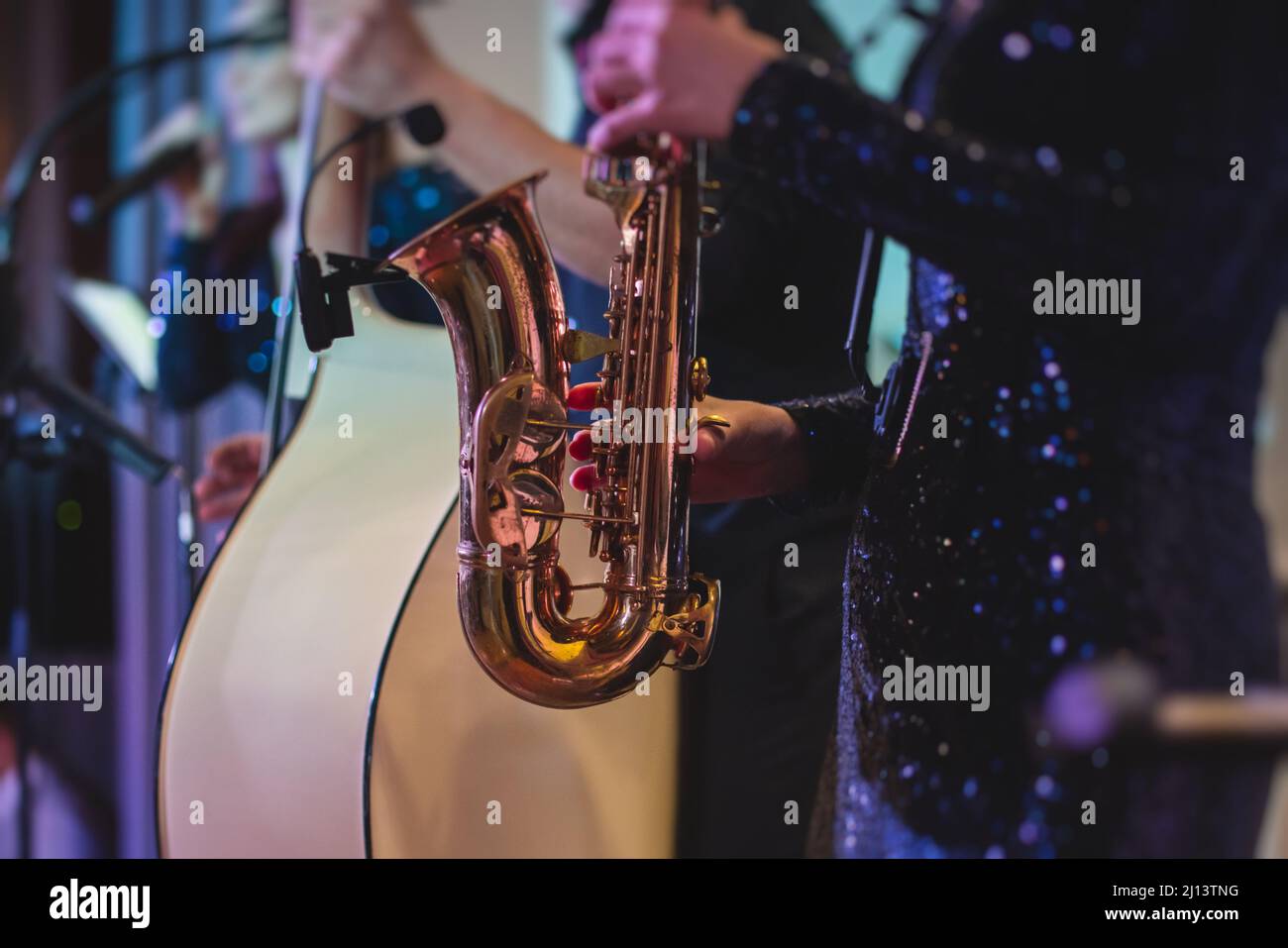 Concert view of a female girl saxophonist, professional saxophone ...
